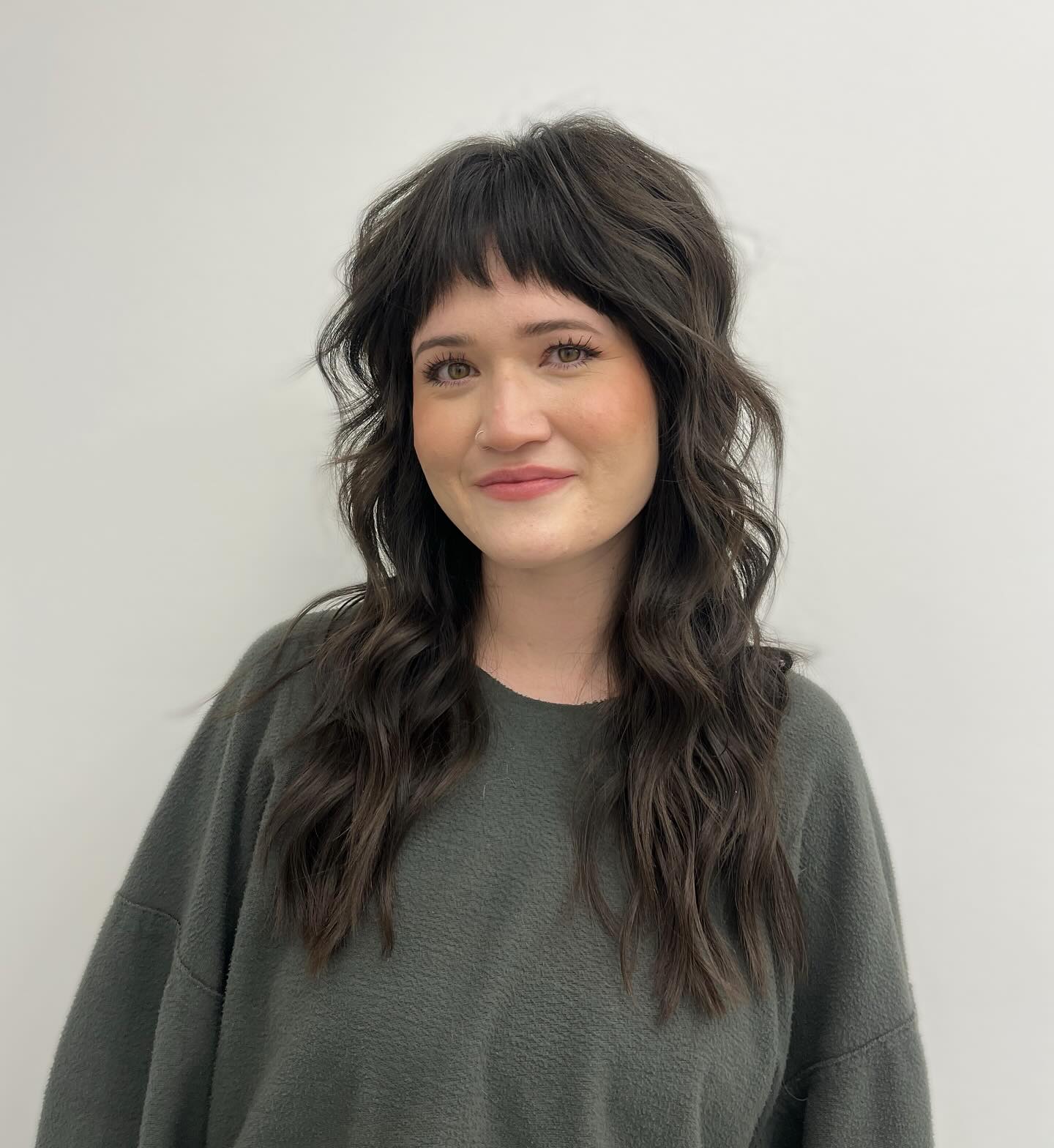 15 Lovely Bangs for Wavy Hair You'll See Everywhere in 2026