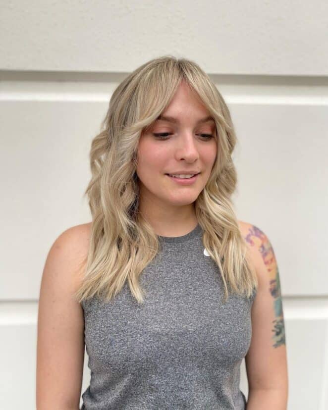 33 Ways to Pair Wavy Hair with Bangs for a Super-Flattering Look